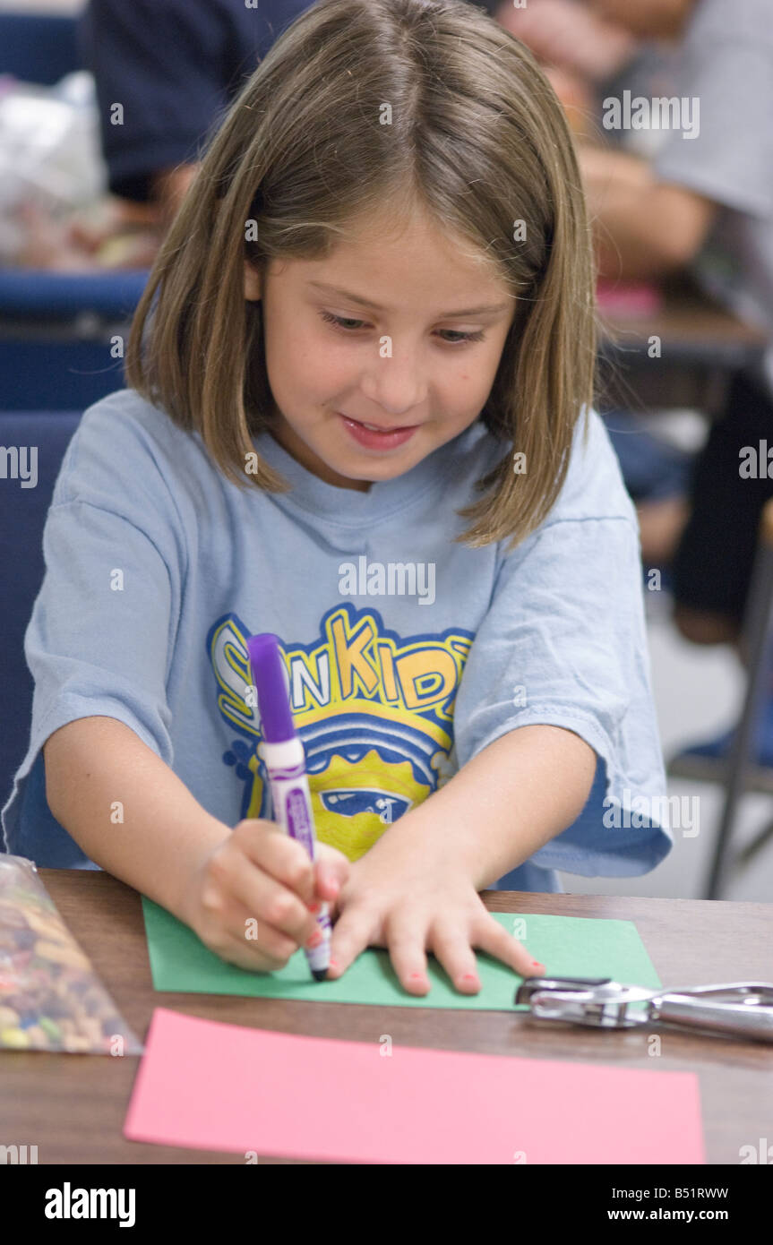 girl working on craft project with marker tracing hand Stock Photo - Alamy