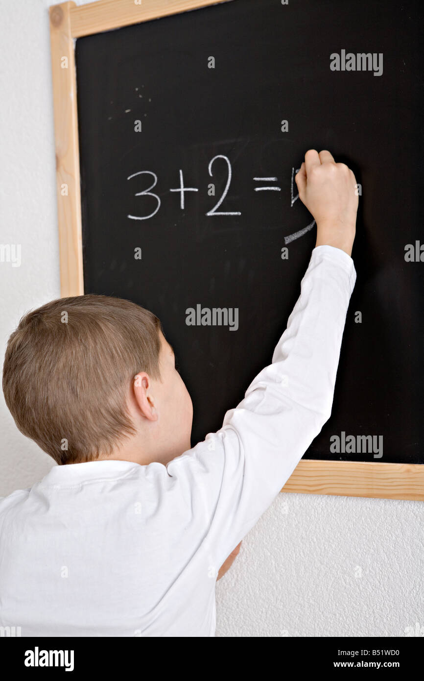 Child when learning arithmetic reading writing Stock Photo - Alamy