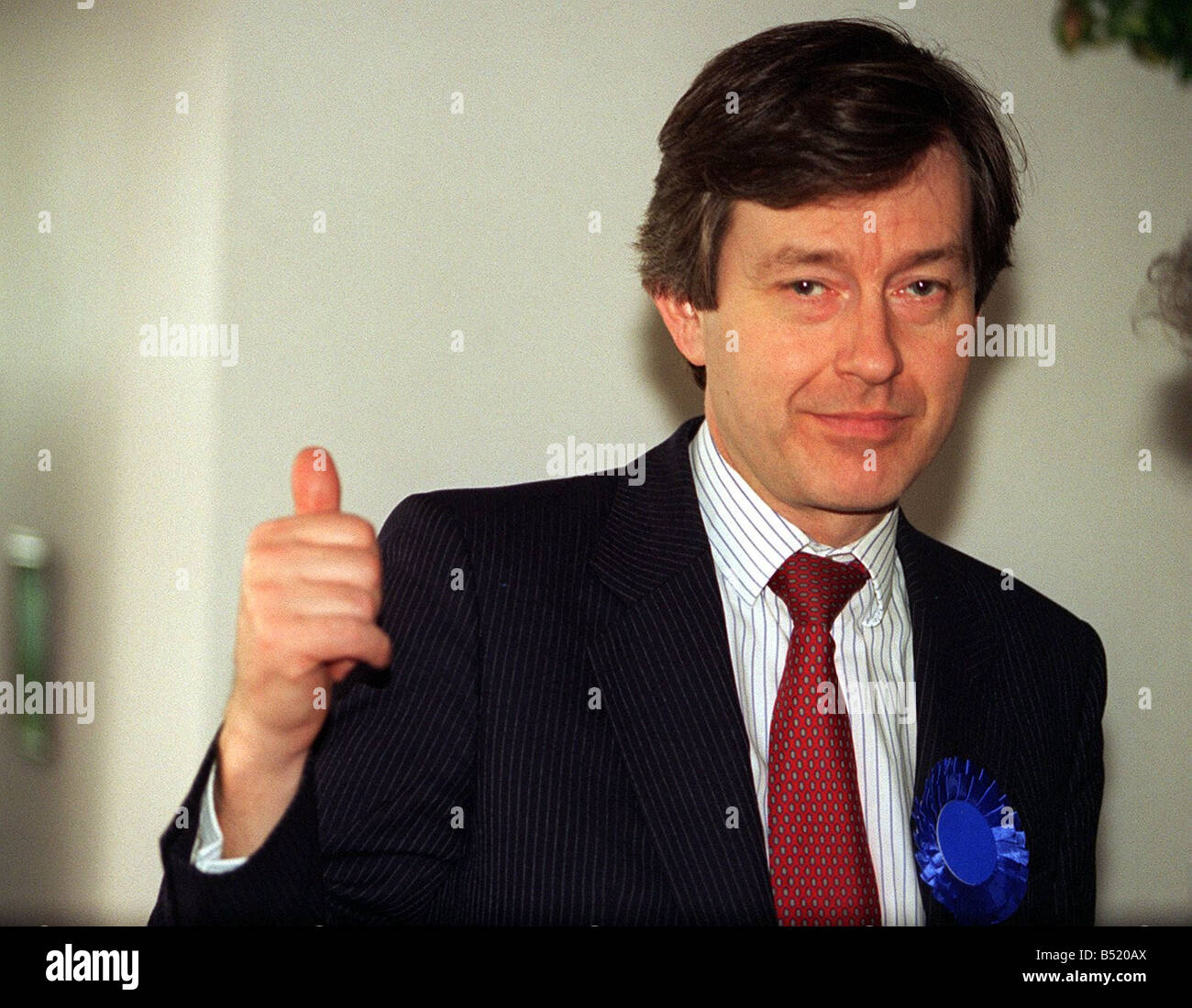 Health Secretary Stephen Dorrell gives the thumbs up sign at Warrington ...