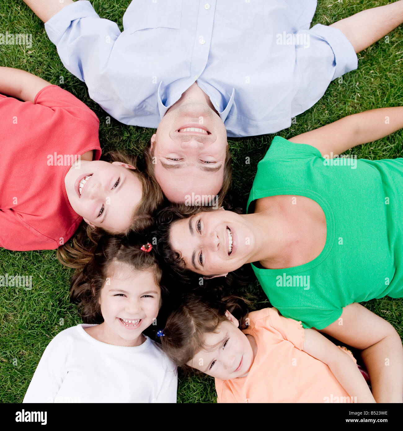 Mother and father with three daughters Stock Photo - Alamy