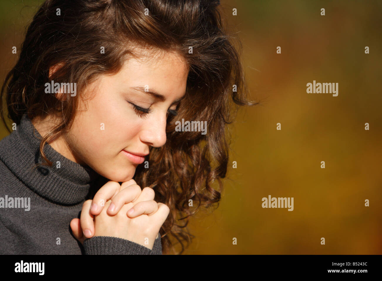 Young woman praying close up Stock Photo - Alamy