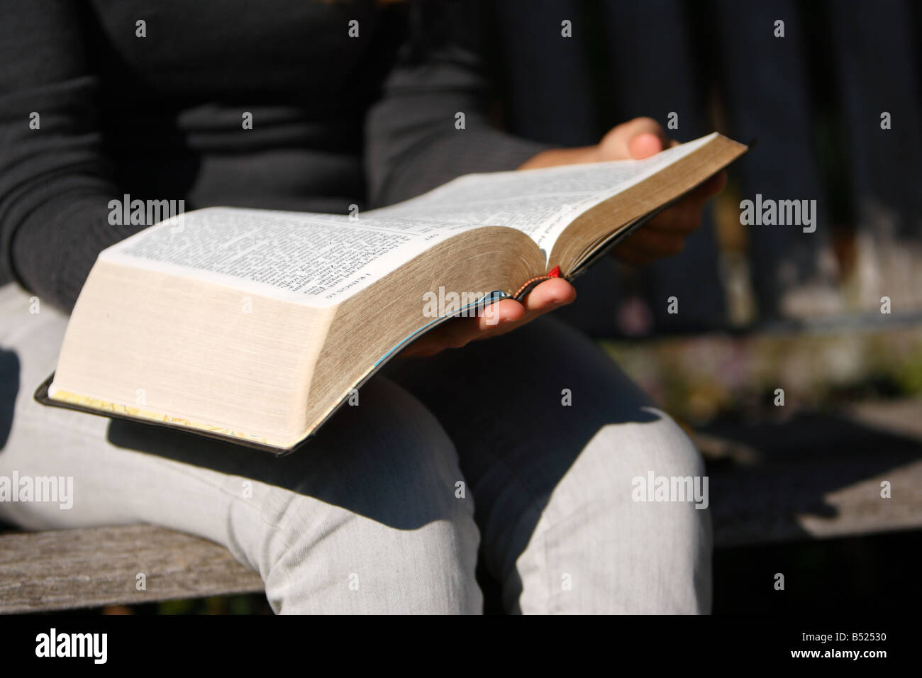 Woman holding bible hi-res stock photography and images - Alamy