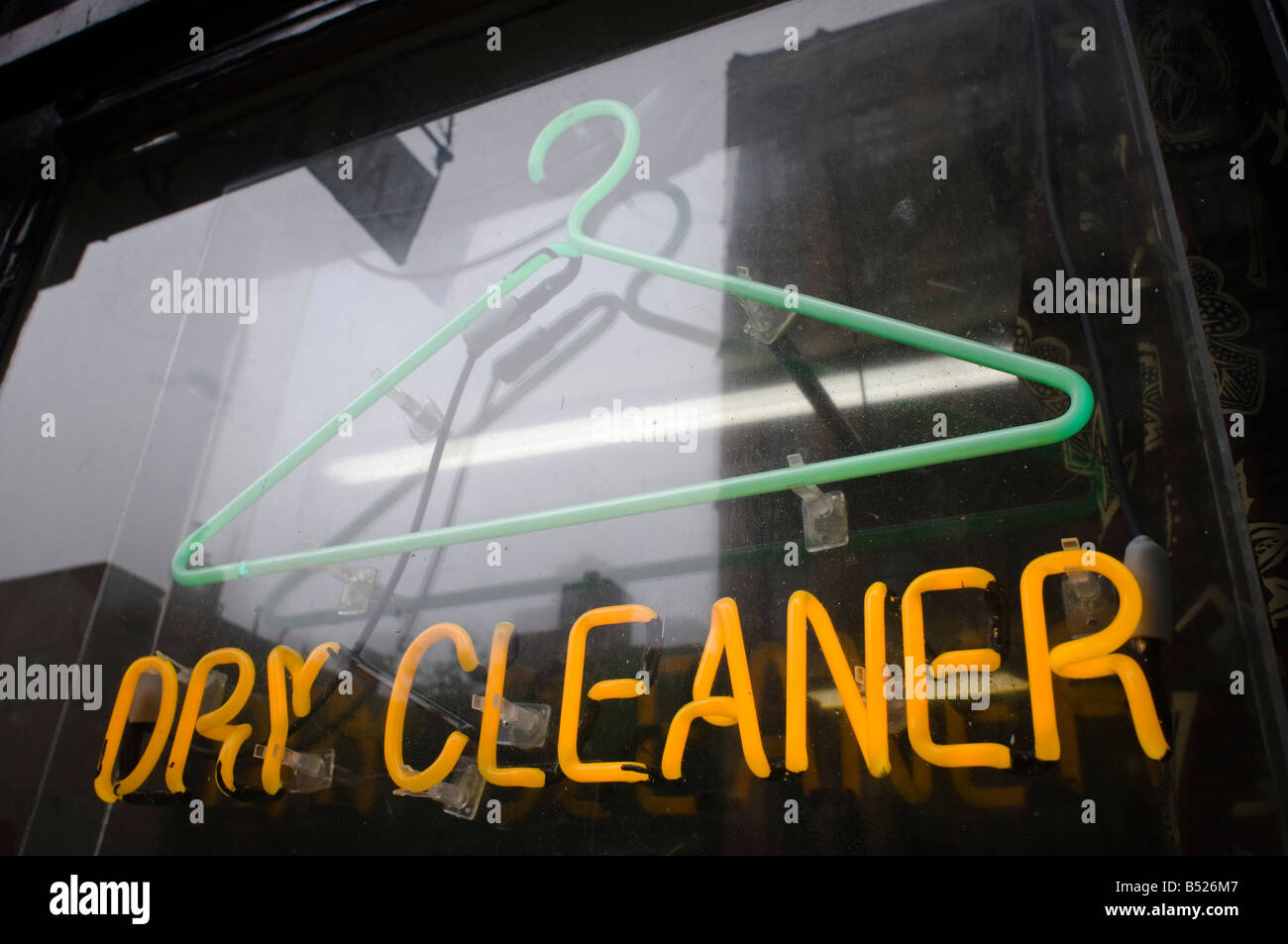colorful neon light sign in NYC dry cleaner store window Stock Photo ...