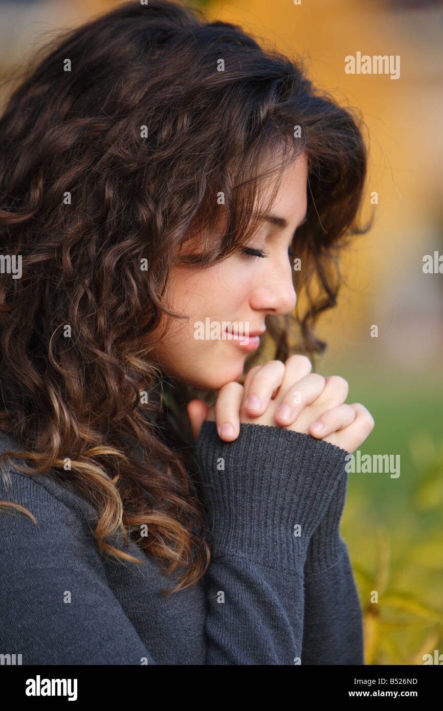 Young woman praying close up Stock Photo - Alamy