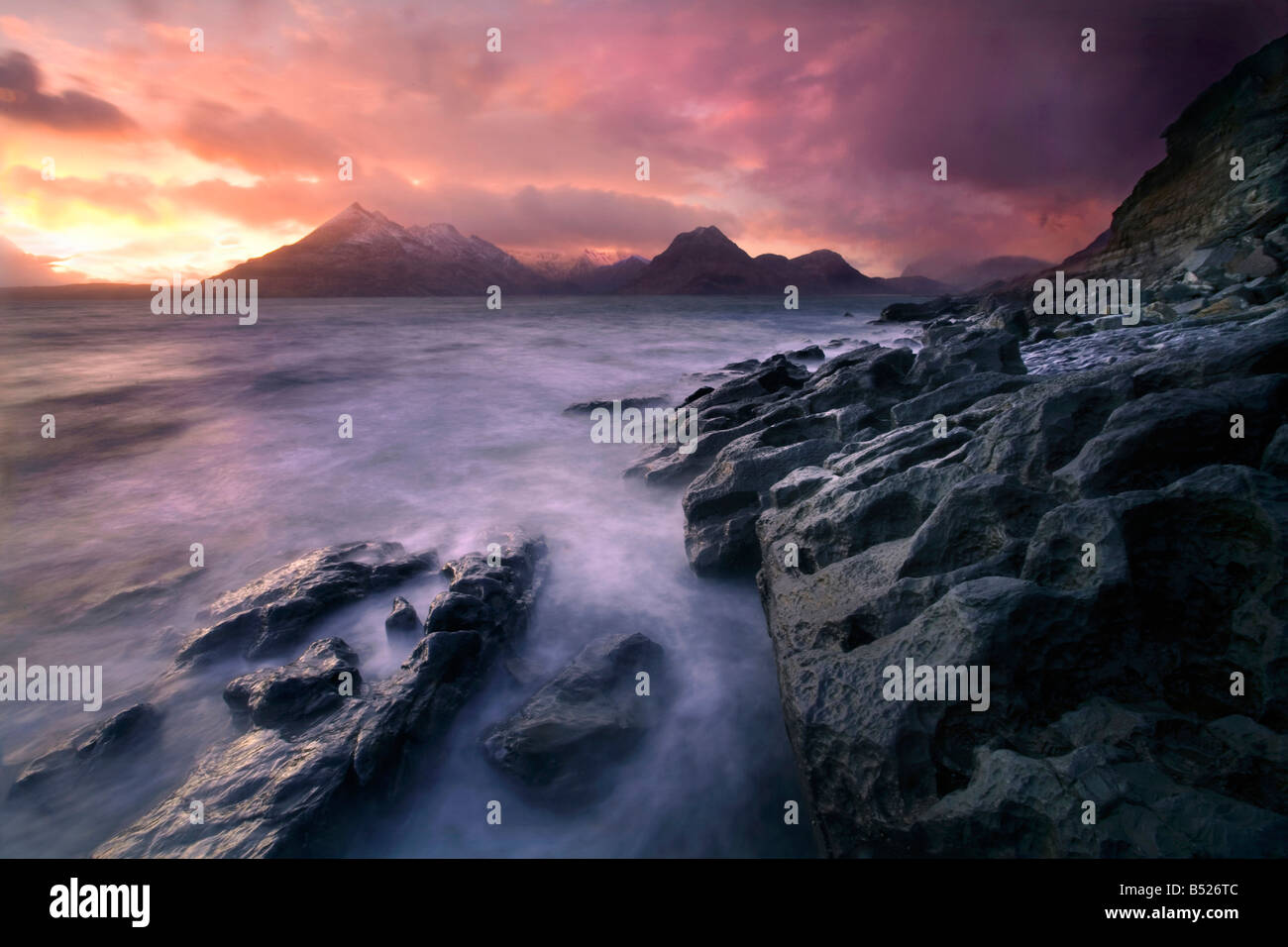 Stormy winter evening sunset along loch scavaig and the Cuillin ...
