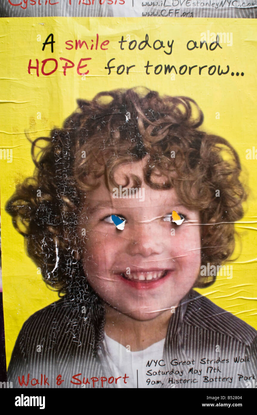 Tattered worn wall poster curly hair smiling young boy Stock Photo - Alamy