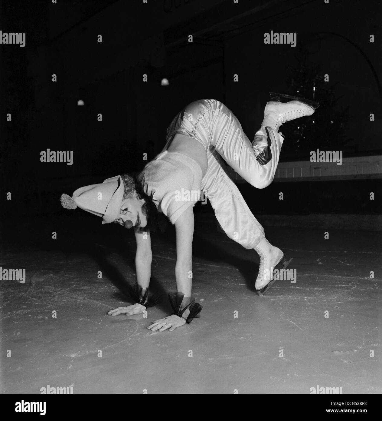 An Ice Skating female Clown performing . January 1953 D597-004 Stock ...