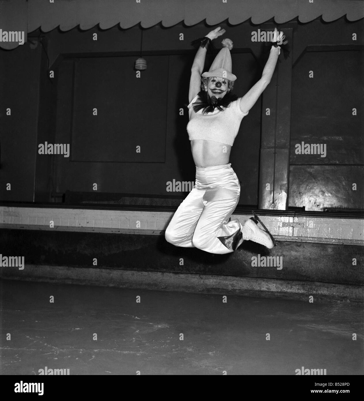 An Ice Skating female Clown performing . January 1953 D597 Stock Photo ...