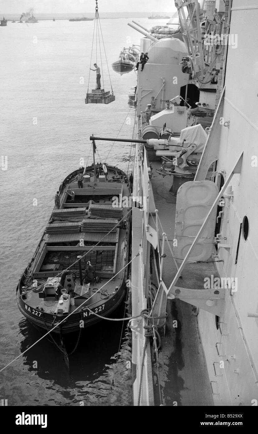 The crew of the County Class cruiser HMS London taking on board ...