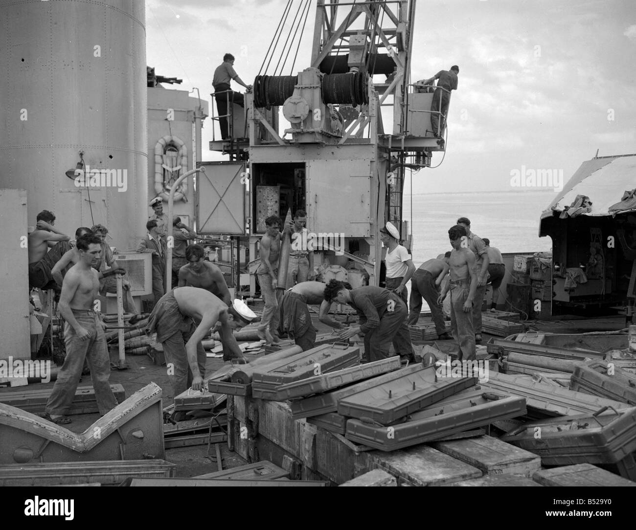 The crew of the County Class cruiser HMS London taking on board Stock ...