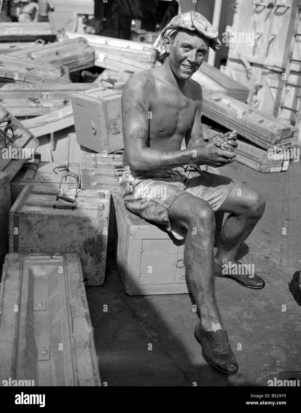The crew of the County Class cruiser HMS London taking on board ...
