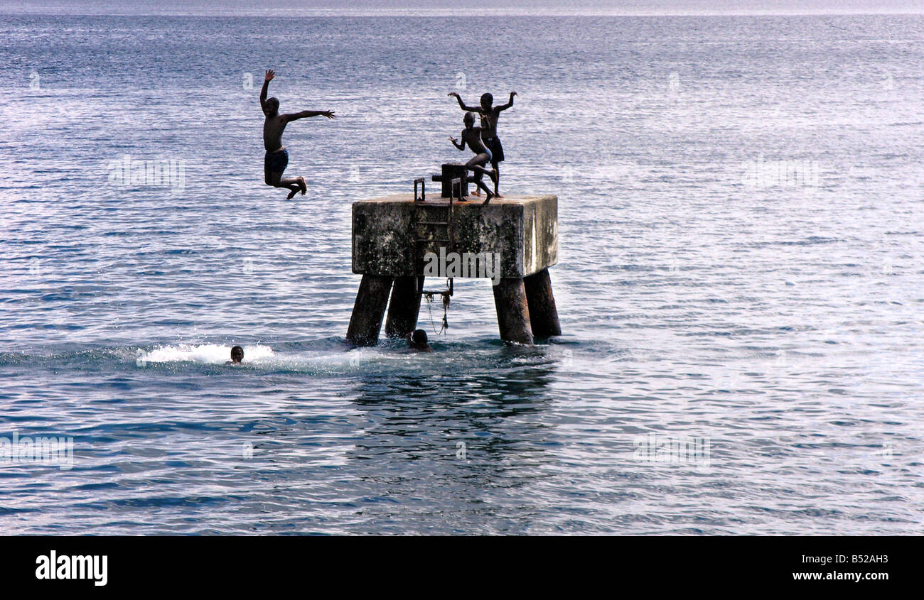 Children jumping off a platform in Roseau Commonweath of Dominica Stock ...
