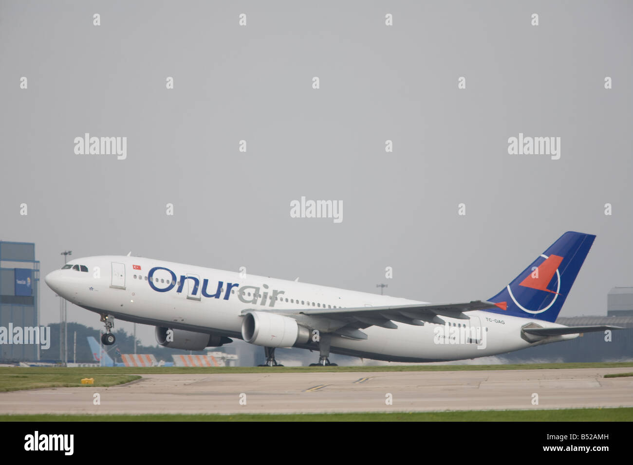 Onurair TC-OAG rotating at take off on runway at Manchester Airport, UK ...