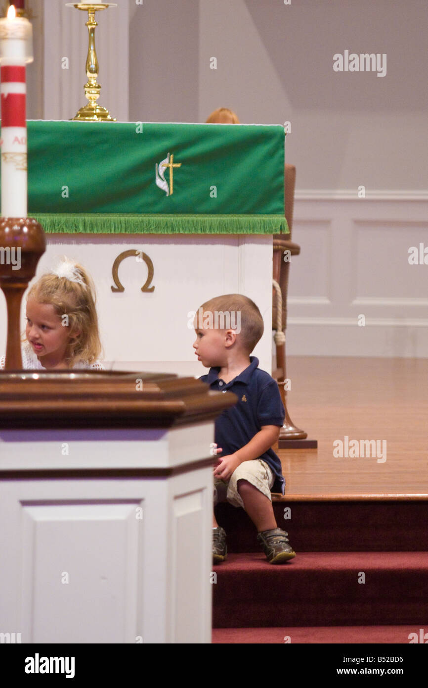 young children react during kids sermon at Sunday church service Stock ...