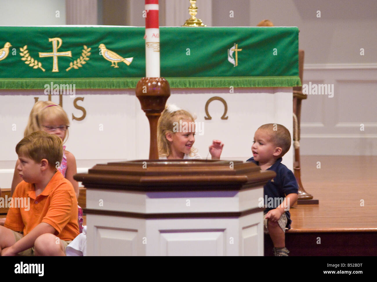 young children react during kids sermon at Sunday church service Stock ...