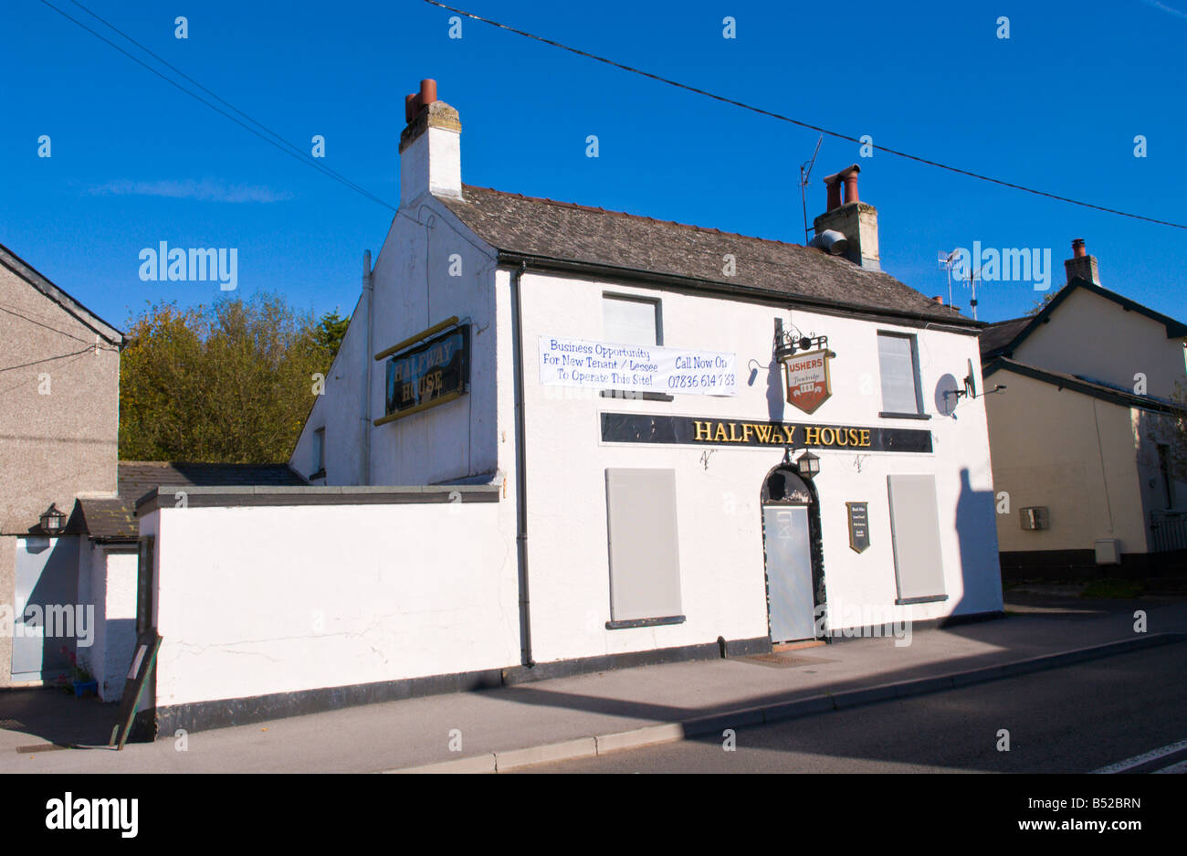 Halfway House pub windows and front door boarded up with steel shutters ...