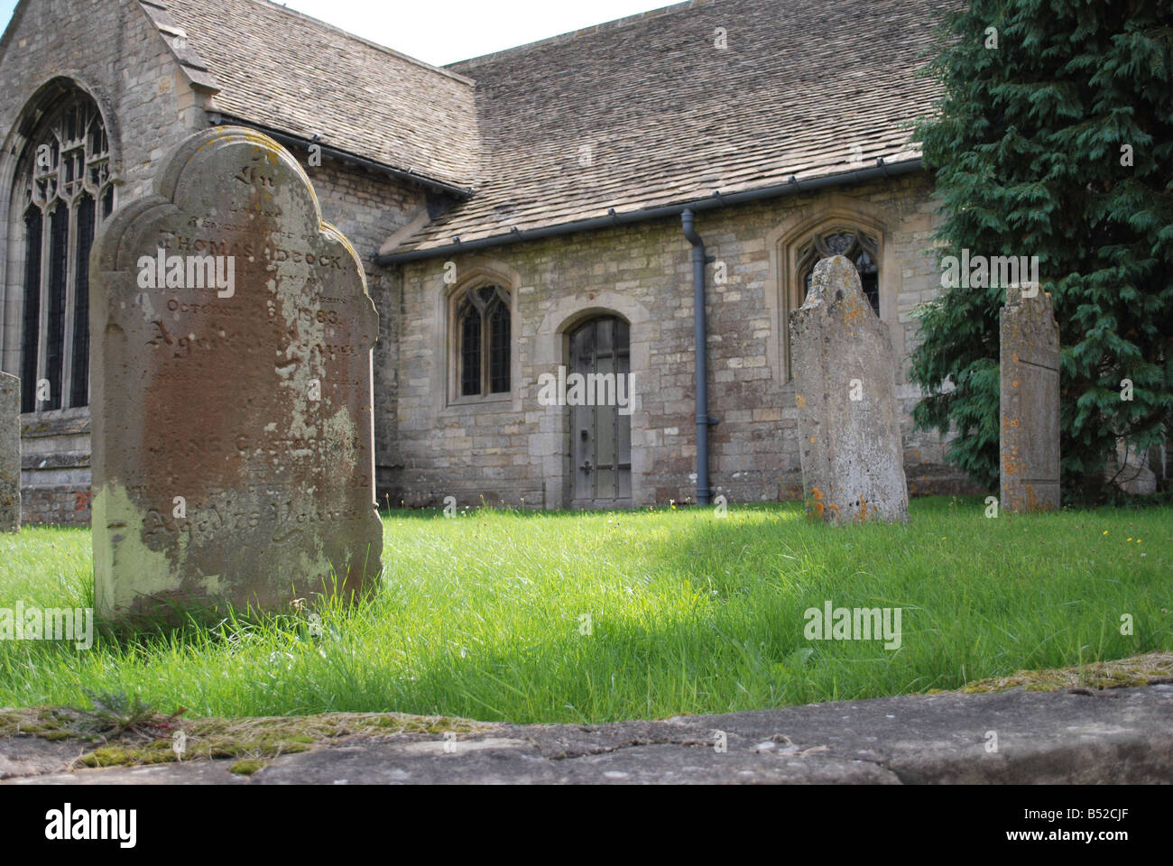 Church and graveyard Stock Photo - Alamy