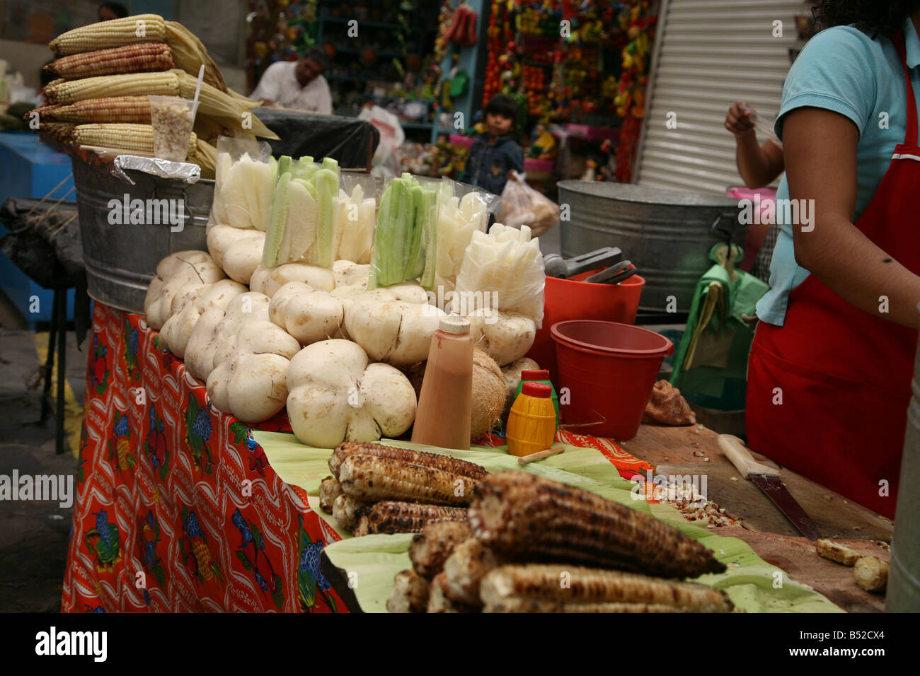 Selling produce at a public market in San Miguel de Allende, Mexico ...