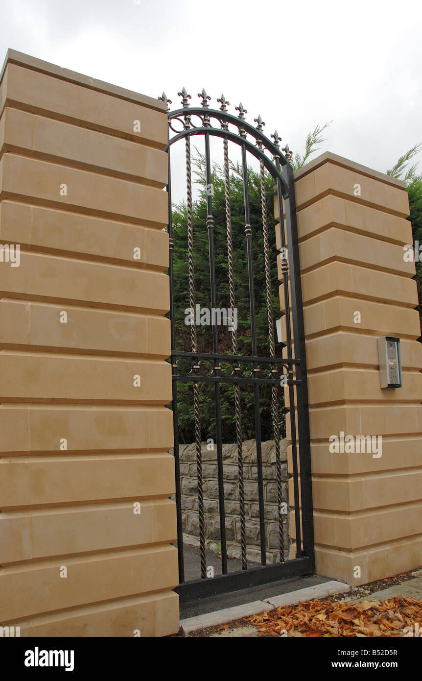 Wall and security gate Stock Photo - Alamy