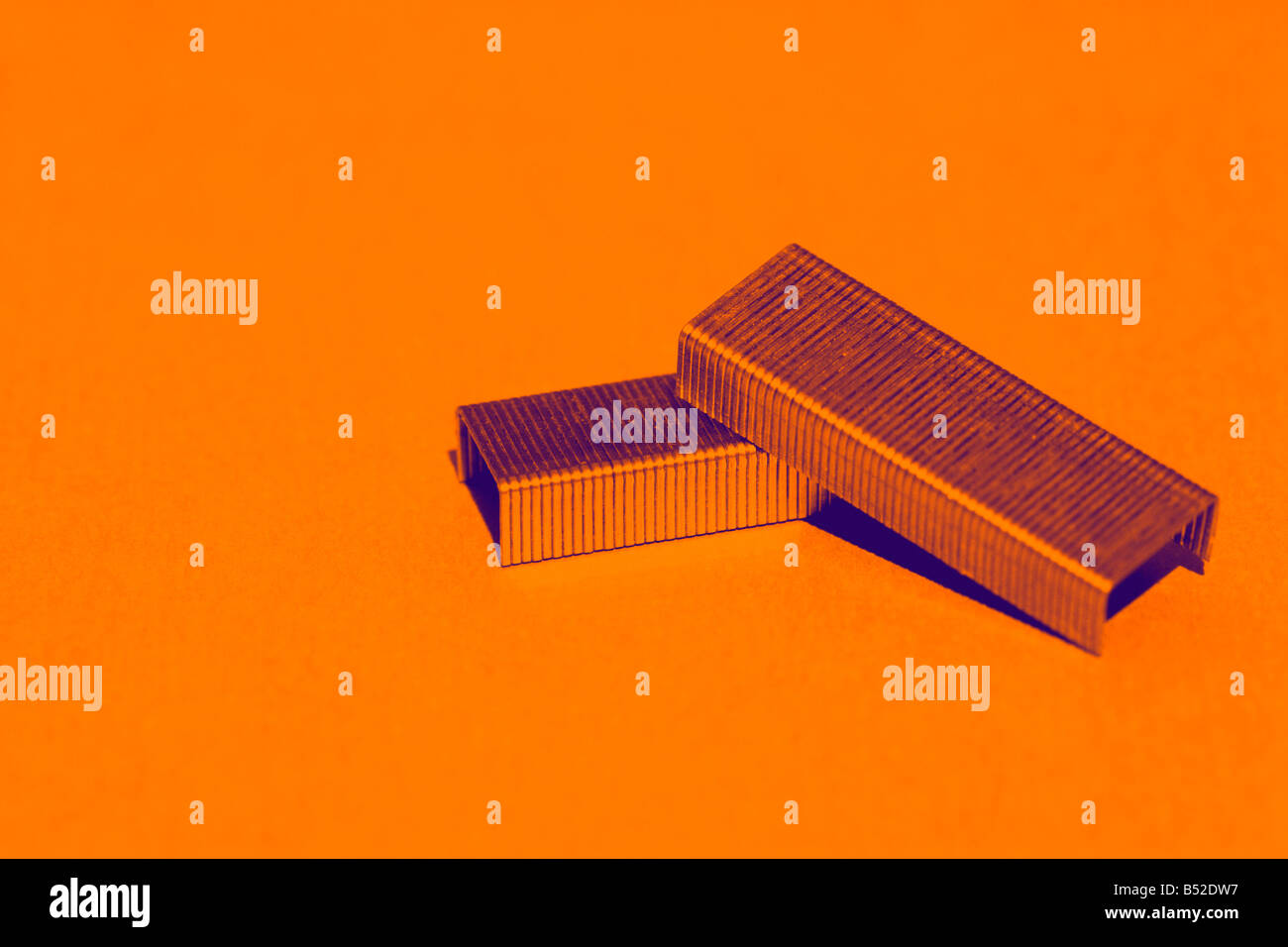 Two sets of staples close up Stock Photo - Alamy
