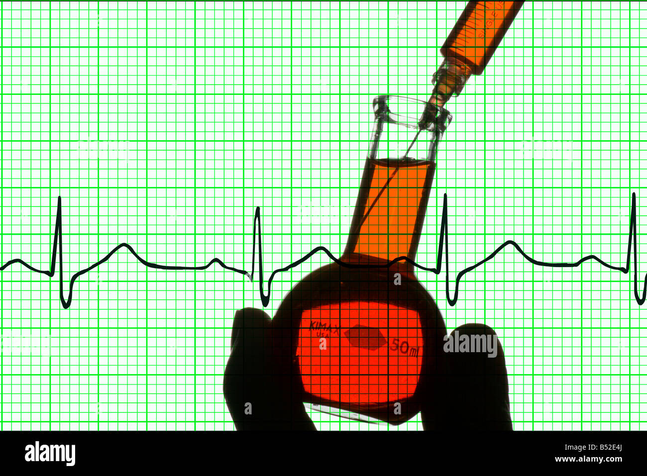 hands holding hypodermic needle and beaker with EKG electrocardiogram ...