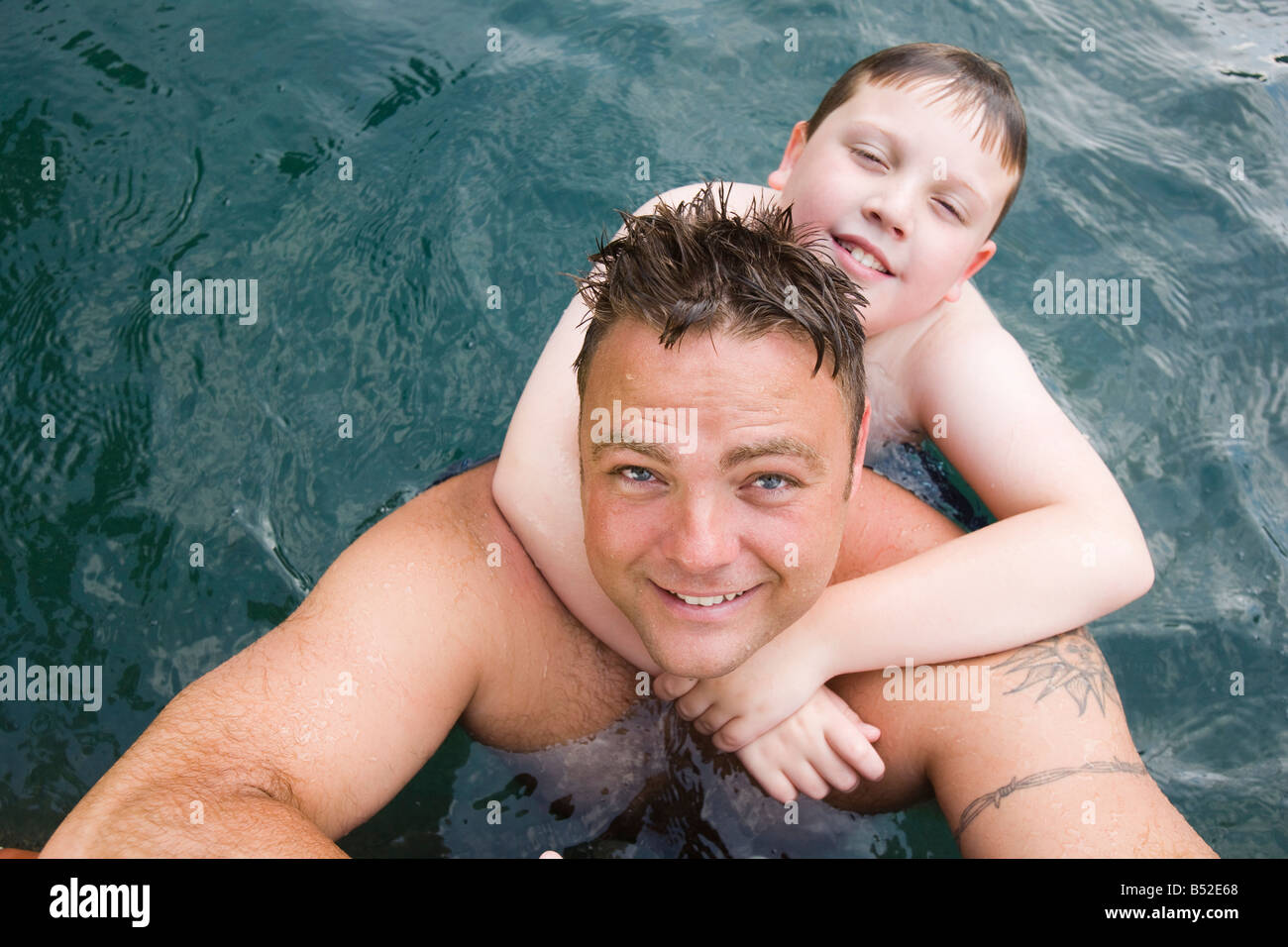 Father and son at swimming pool hi-res stock photography and images - Alamy