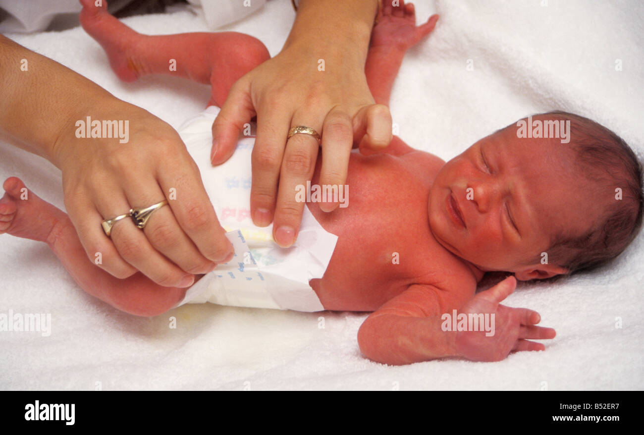 Baby girl changed diaper hi-res stock photography and images - Alamy