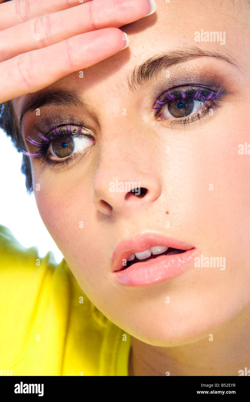 woman with her hand on her forehead Stock Photo - Alamy