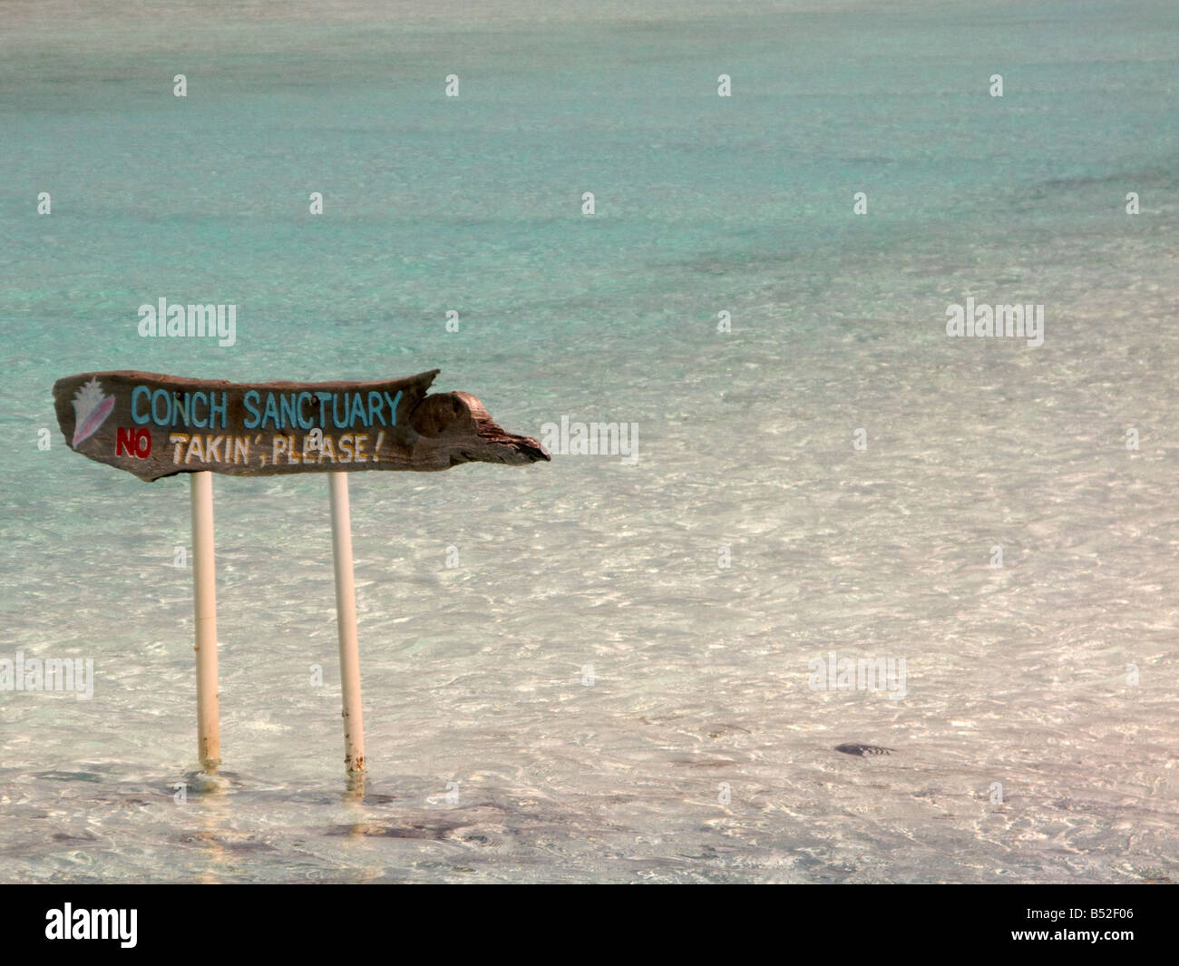 A sign posted in the sand at Compass Cay in the Exumas Island chain in ...