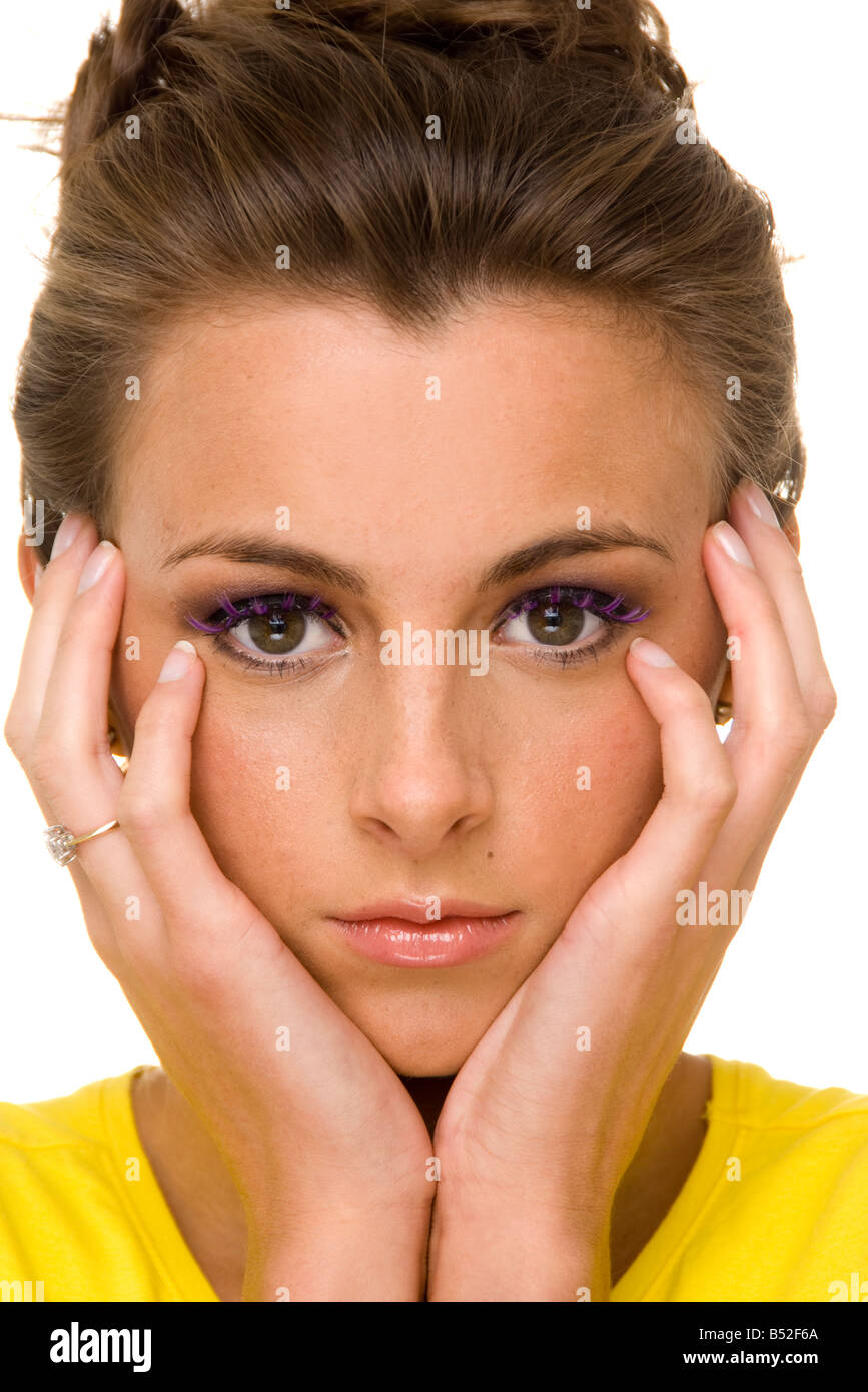 woman with her head cupped in her hands looking fed up Stock Photo - Alamy