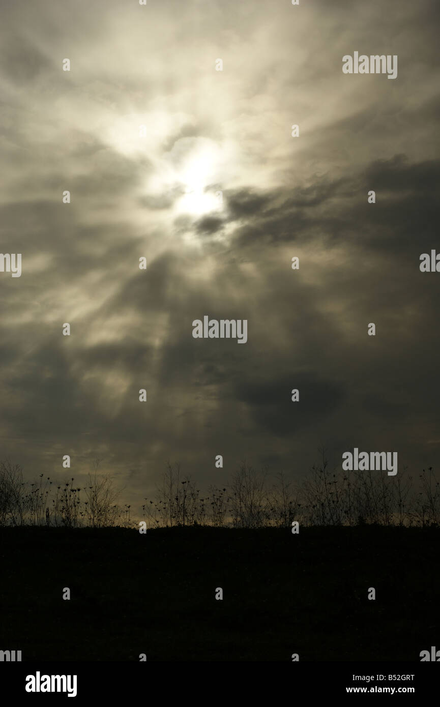 Sun shining through the clouds Stock Photo - Alamy