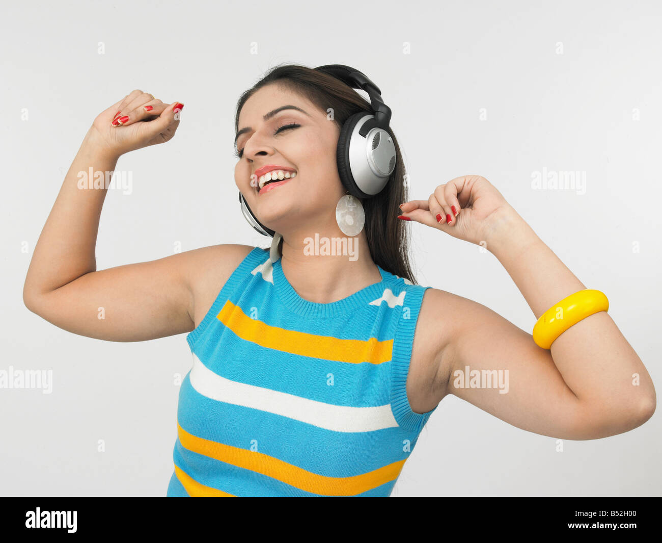 a beautiful asian female enjoying music Stock Photo - Alamy