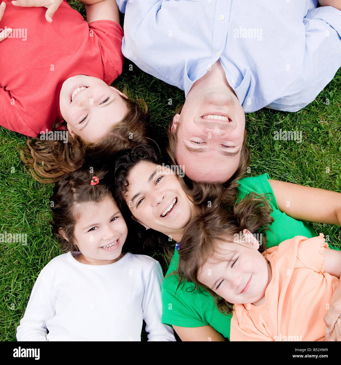 Mother and father with three daughters Stock Photo - Alamy
