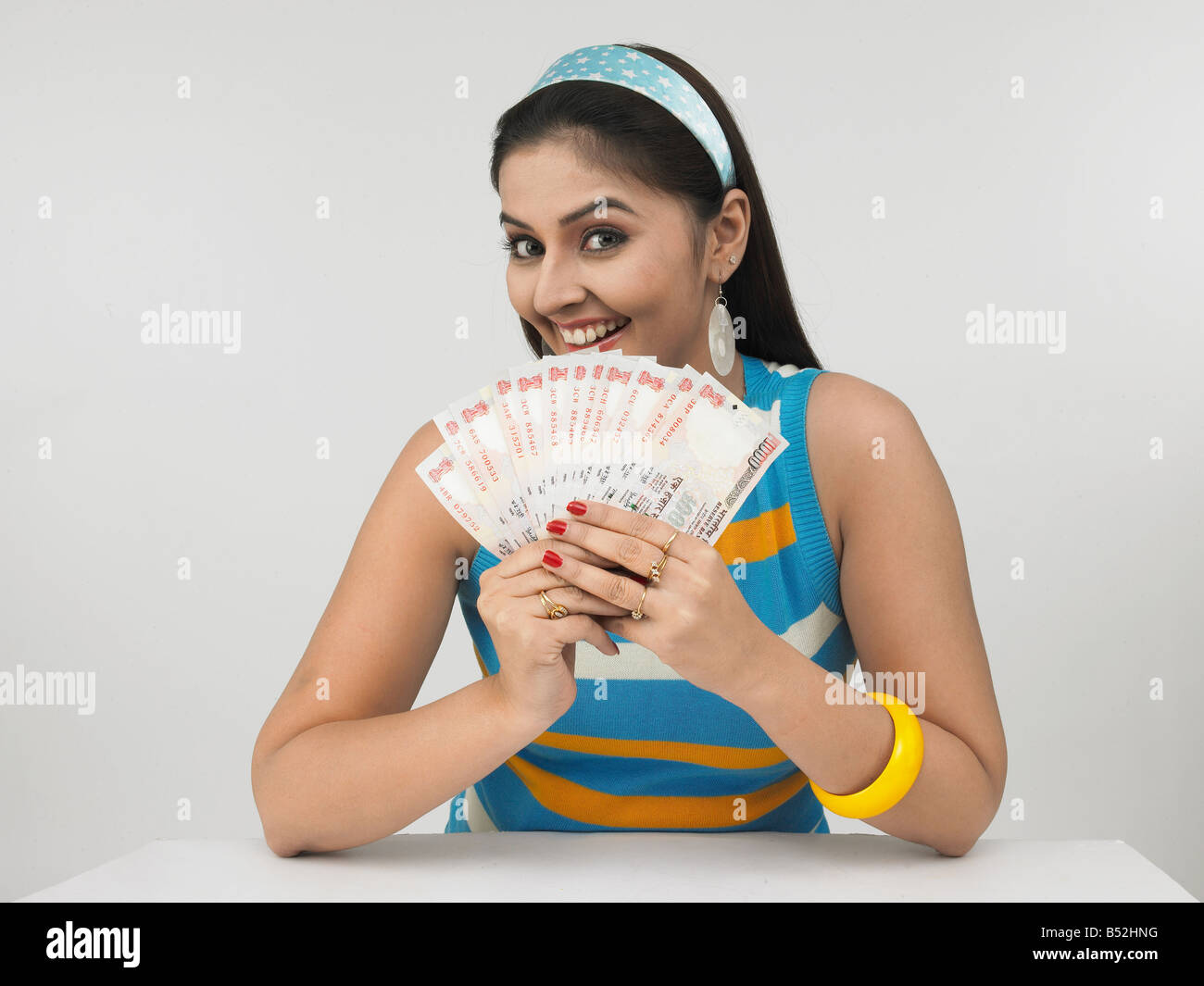 an attractive asian female with currency notes Stock Photo - Alamy