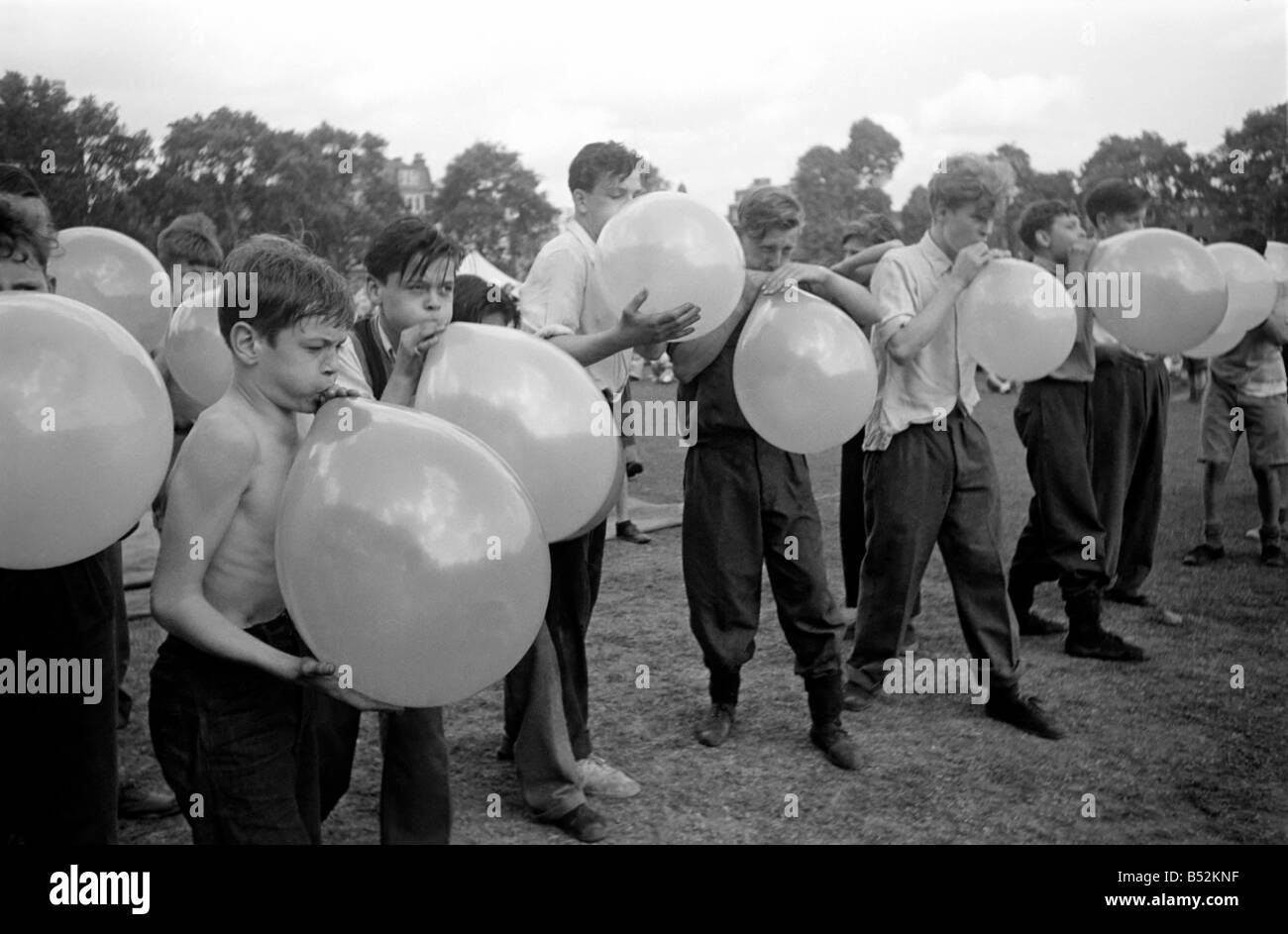 Balloon bursting competition during a children's sports day. August ...