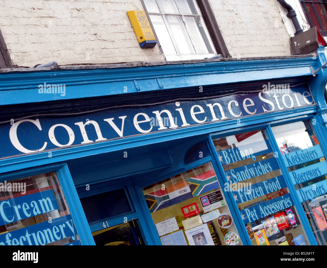 convenience store front with South African flags in window Stock Photo ...