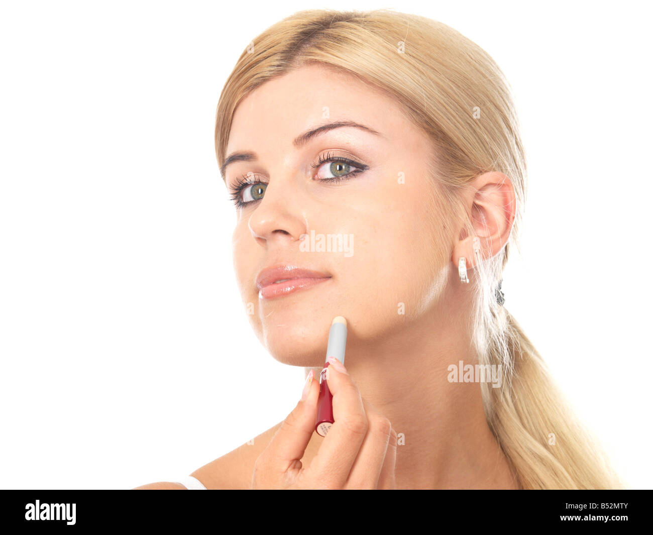Young Woman Applying Concealer Model Released Stock Photo - Alamy