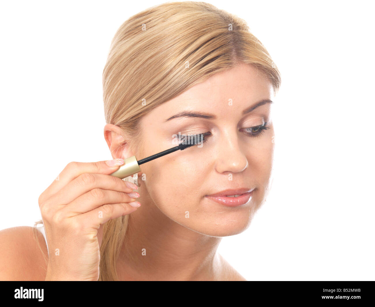 Young Woman Applying Mascara Model Released Stock Photo - Alamy