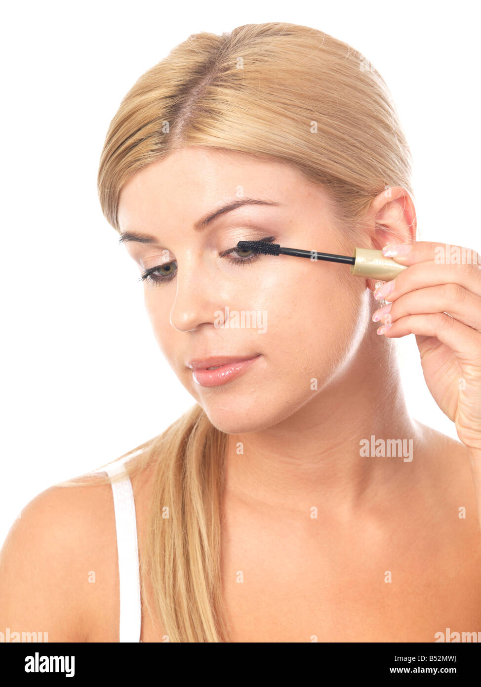 Young Woman Applying Mascara Model Released Stock Photo - Alamy