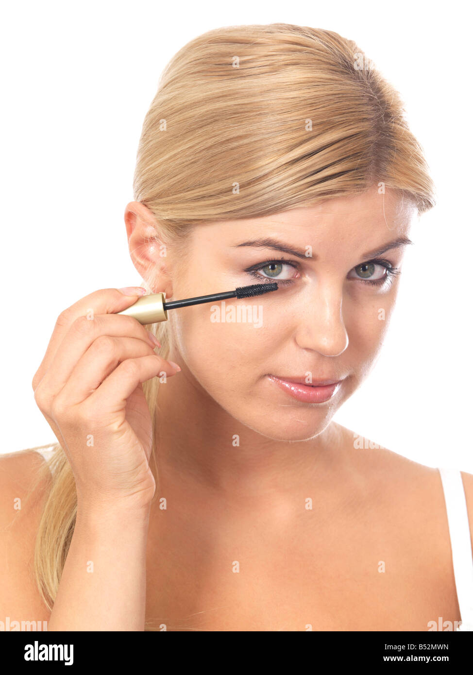 Young Woman Applying Mascara Model Released Stock Photo - Alamy