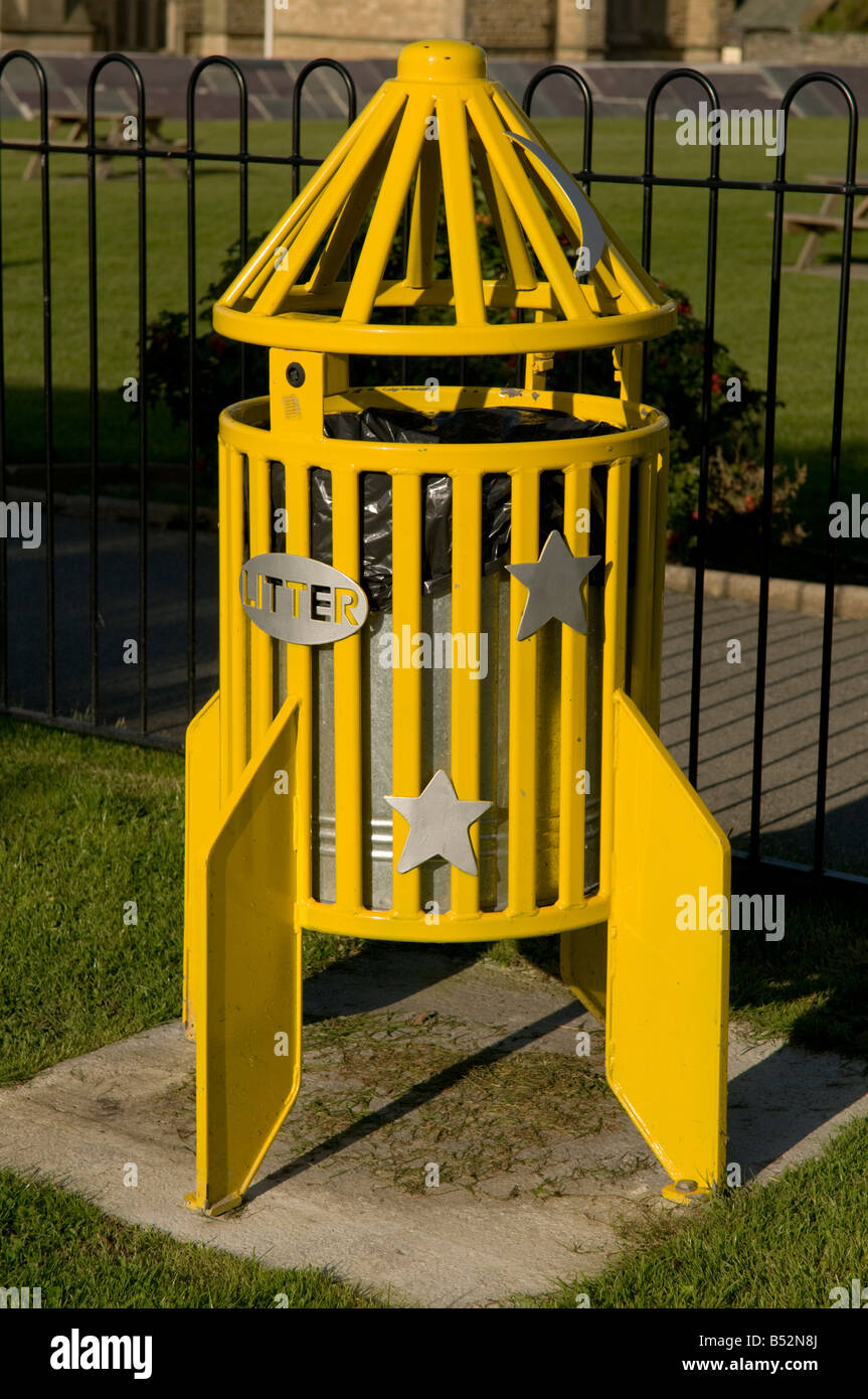 yellow space rocket shaped litter bin Stock Photo - Alamy