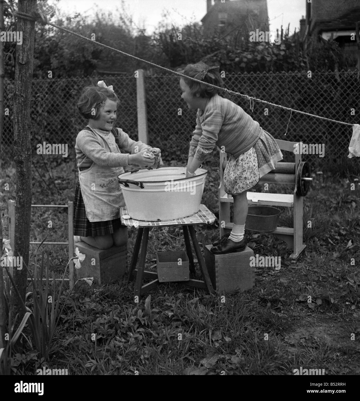 Hanging out washing Black and White Stock Photos & Images - Alamy