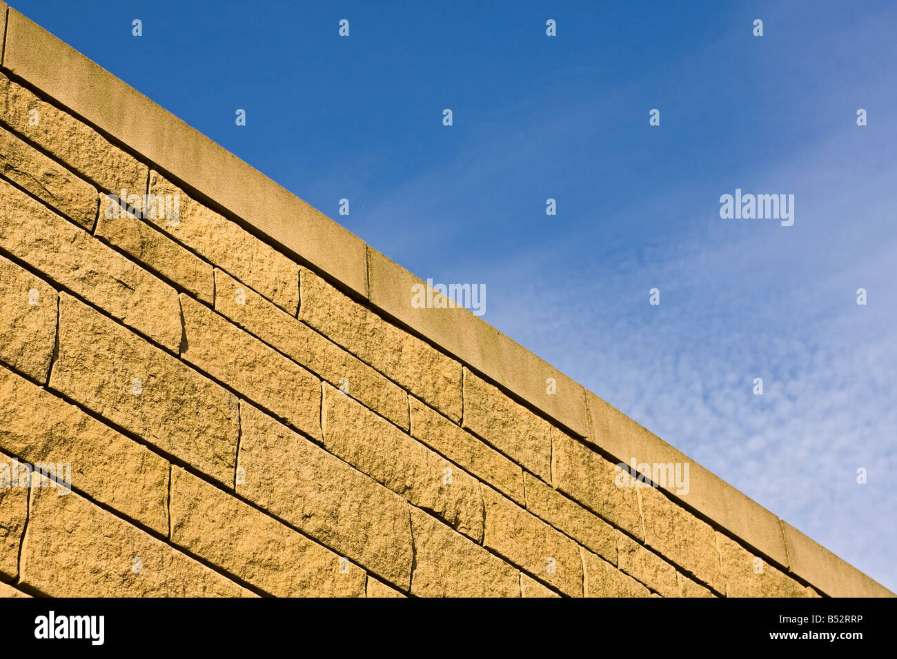 Abstract photograph of a sandstone wall against a blue sky Stock Photo ...