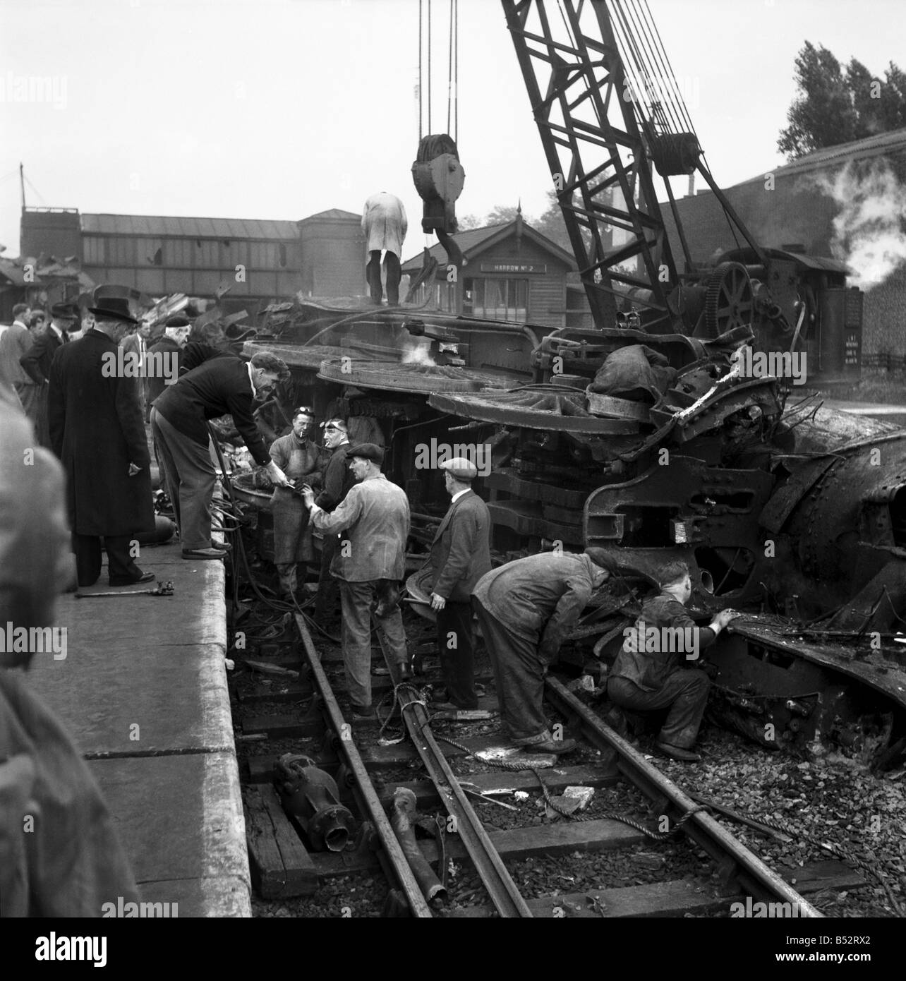 Harrow and Wealdstone Train Crash. Wreckage and bodies are cleared away ...
