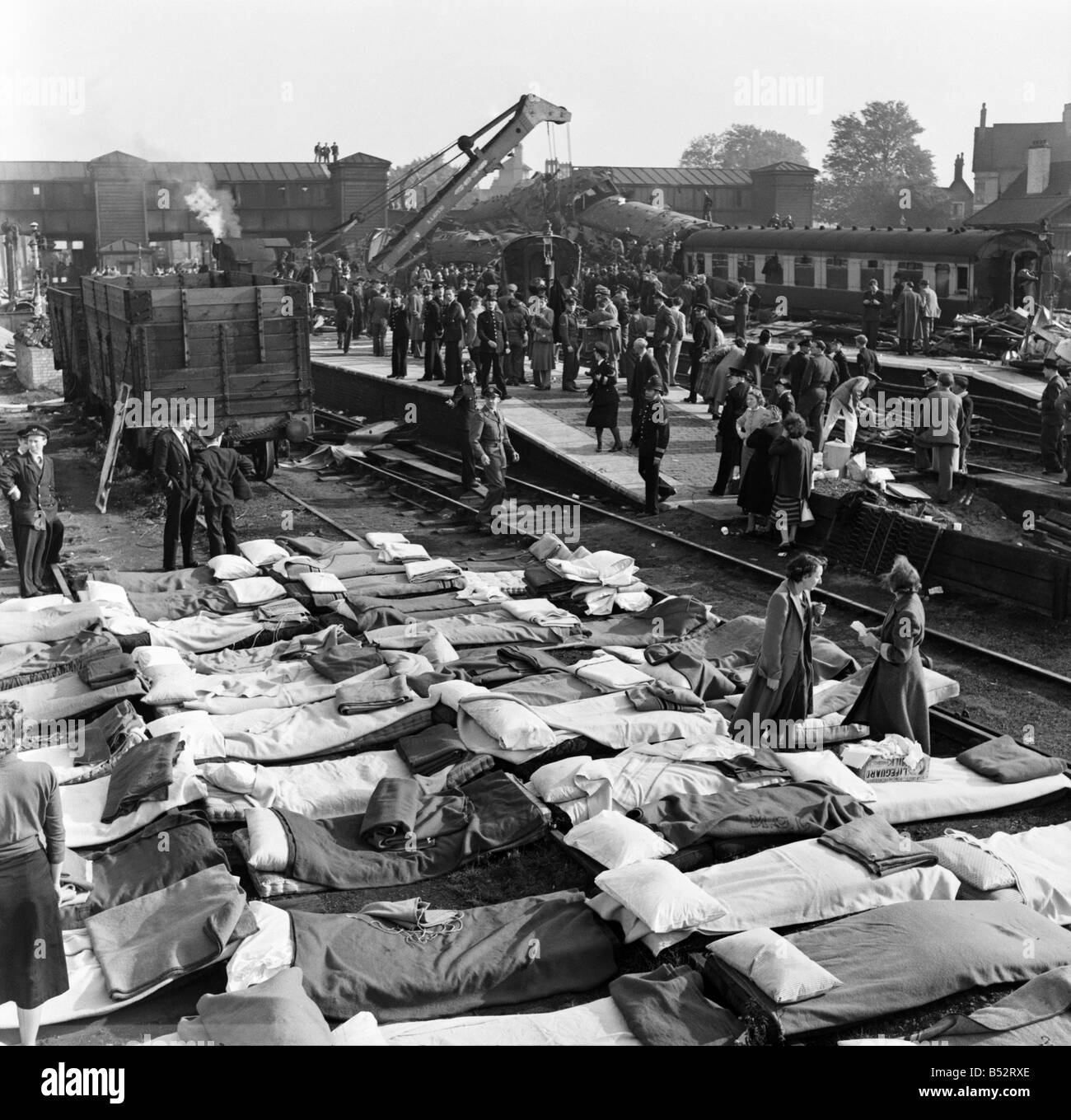 Harrow and Wealdstone Train Crash. Wreckage and bodies are cleared away ...
