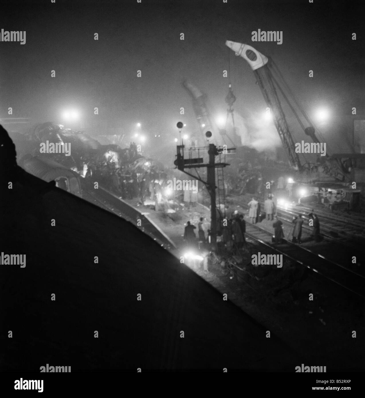 Harrow and Wealdstone Train Crash. Wreckage and bodies are cleared away ...