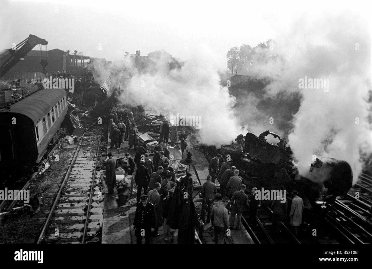 Harrow and Wealdstone Train Crash. A rescue worker giving aid to a ...