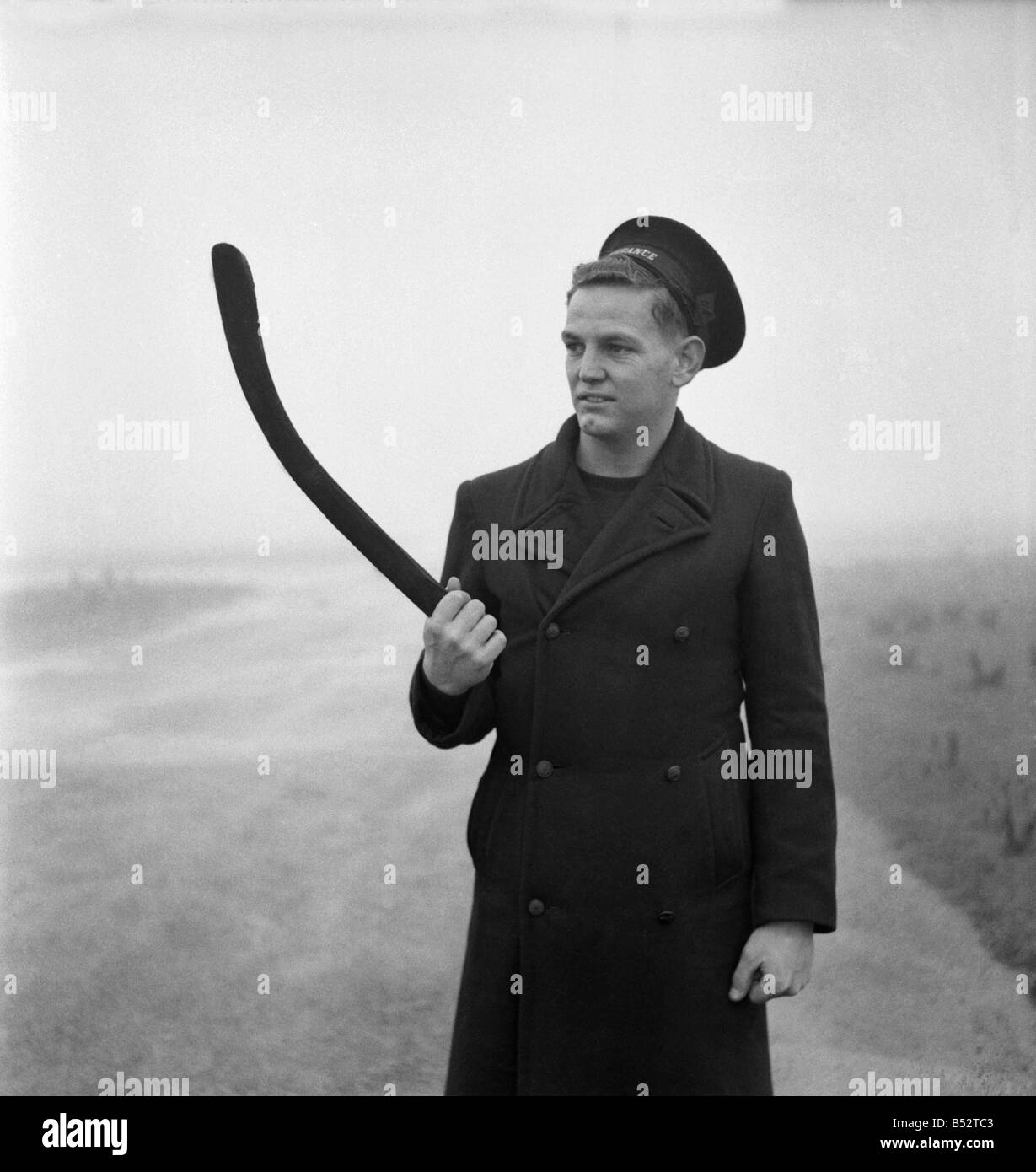 Australian Sailor Eddie Cook is a keen boomerang thrower. November 1952 ...