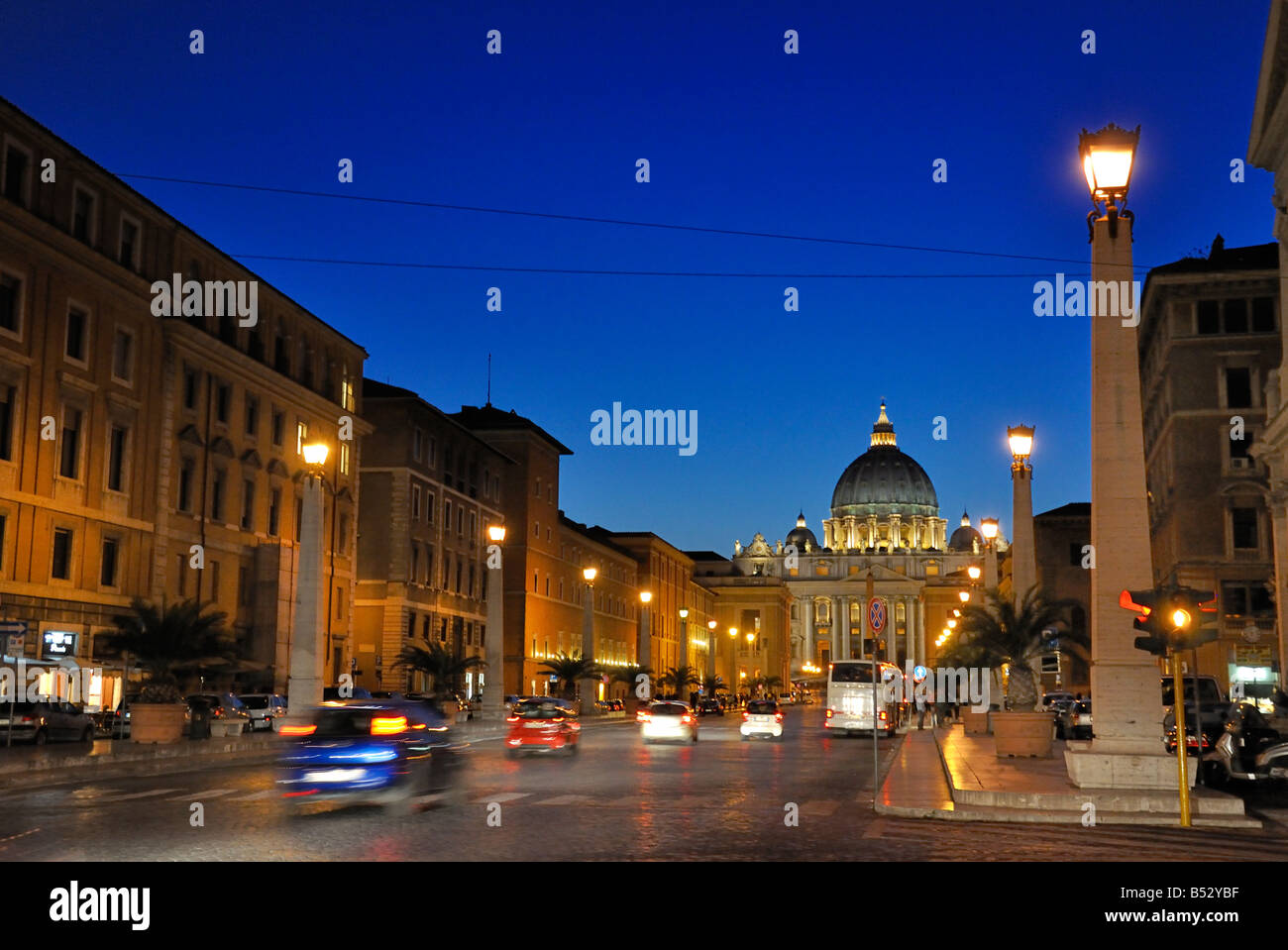 A night view of Saint Peter's and cars on the Via della Concilazione ...