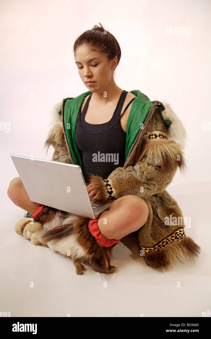 Native Alaskan Inupiat Woman in Wolf Fur Coat in Studio w/ laptop ...